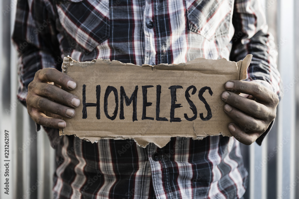 Homeless man holding sign Stock Photo | Adobe Stock