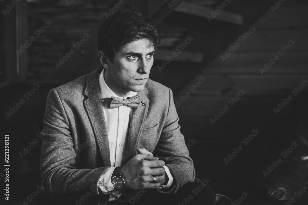 Serious, Imposing well dressed in suit man in a luxurious apartments ...
