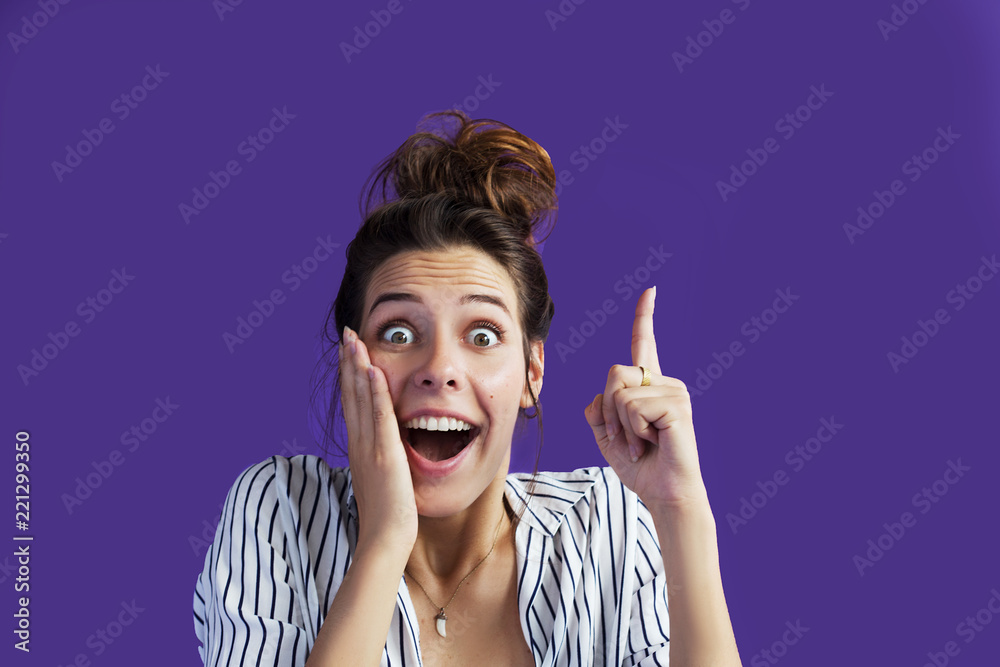 In perplexity the girl shows her fingers in her head with something ...