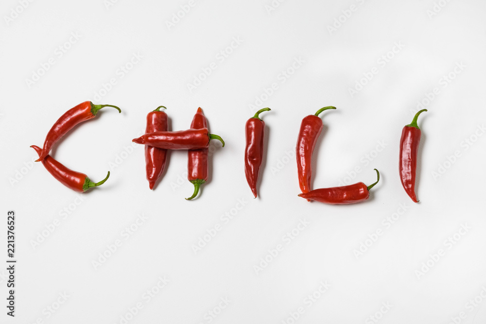 Red chili peppers spelling the word chili. Red and spicy chili pepers ...