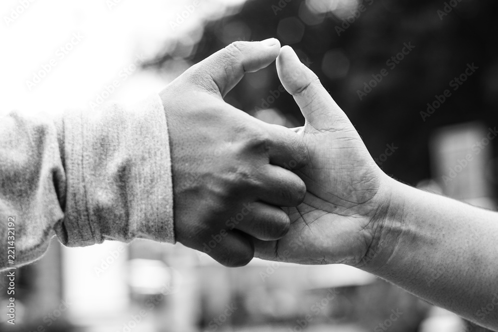 Thumbs war hand finger game on black and white , bokeh background Stock ...