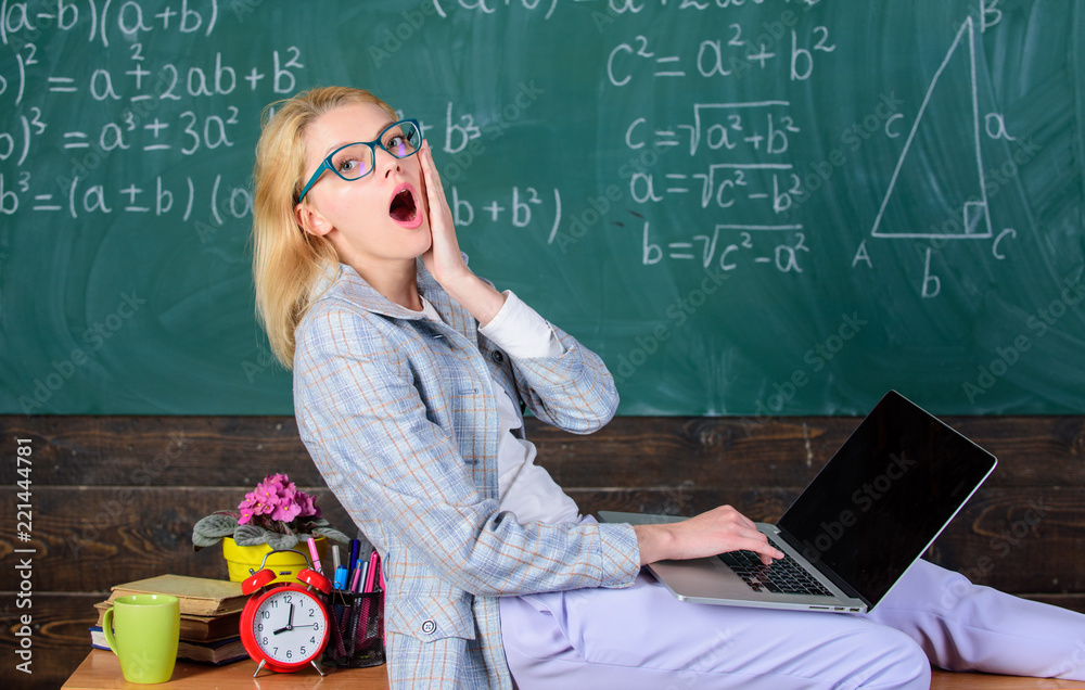 Woman tired teacher work laptop classroom chalkboard background ...