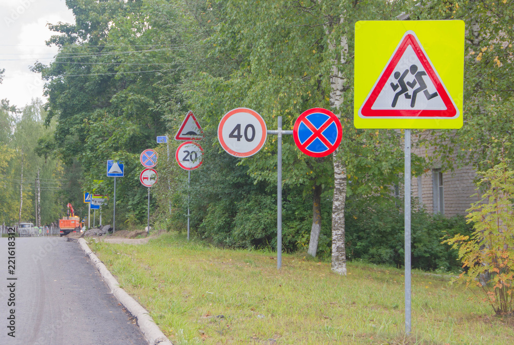 many road signs along the road. Traffic signs.. Stock Photo | Adobe Stock
