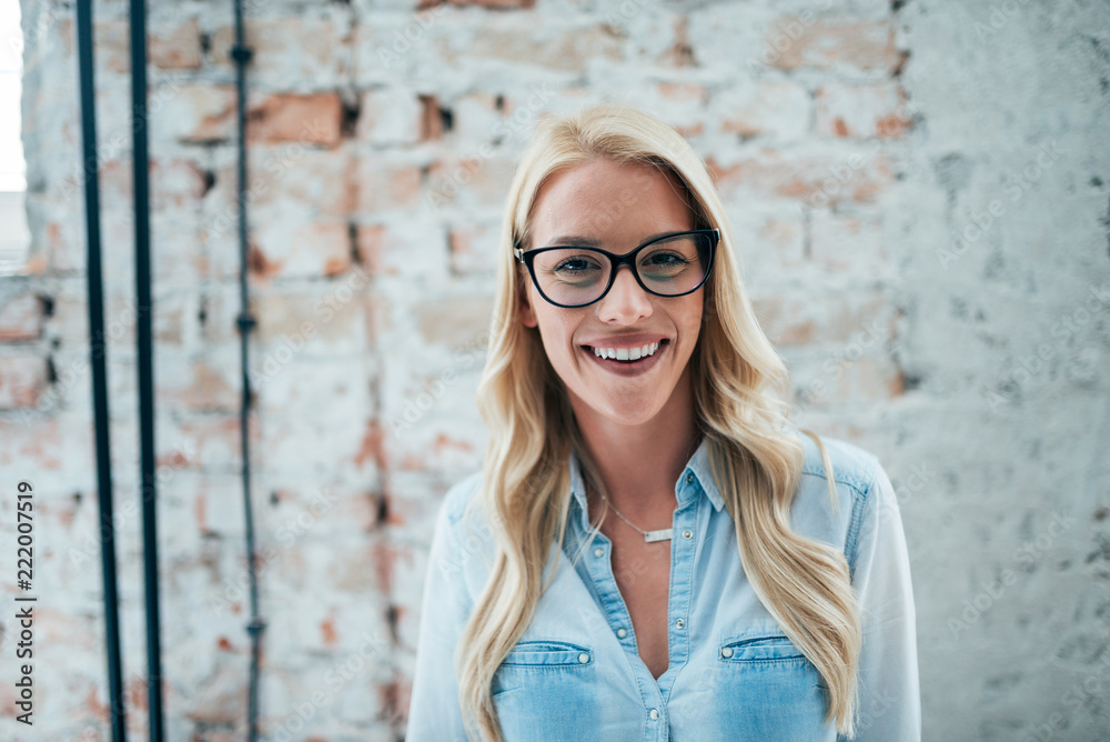 Headshot of a gorgeous smiling blonde woman. Stock Photo | Adobe Stock