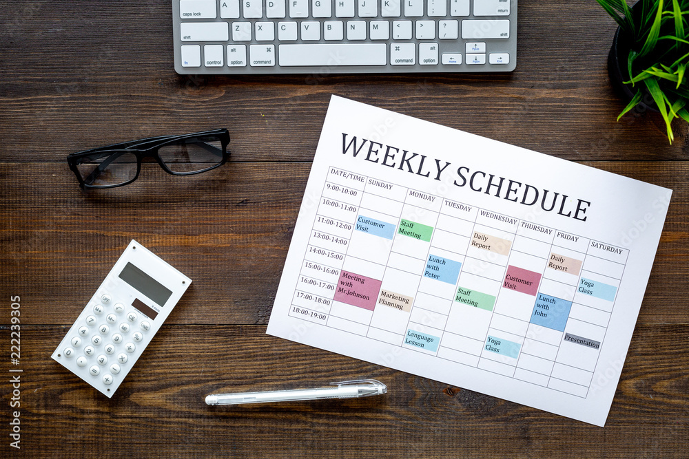Weekly schedule. Planning the week. Multicolored planner on manager ...