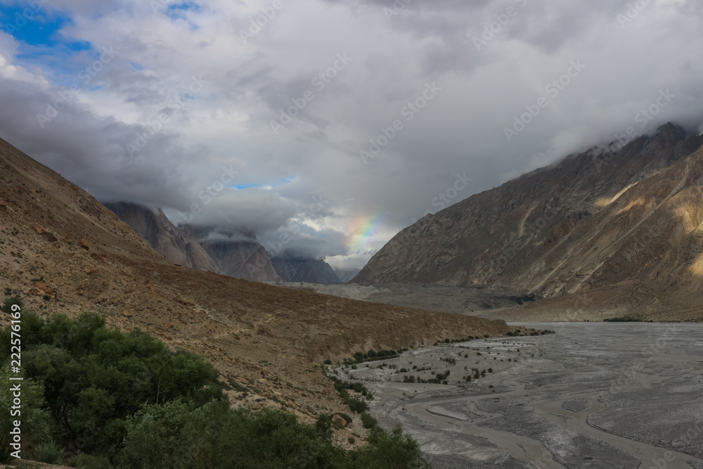 The river flows through the hills and mountain in the Askole village ...