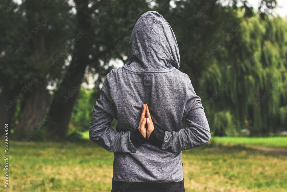creative prayer pose by human hands concept shot with backwards clothes ...