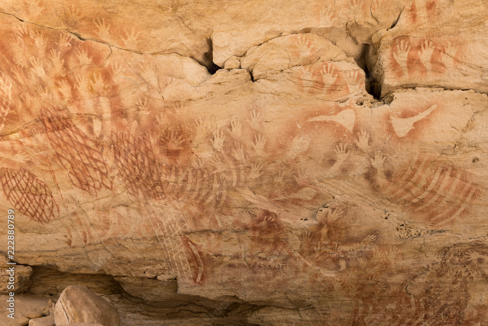 Aboriginal stencil rock art of hands, nets and stone axes at Cathedral ...