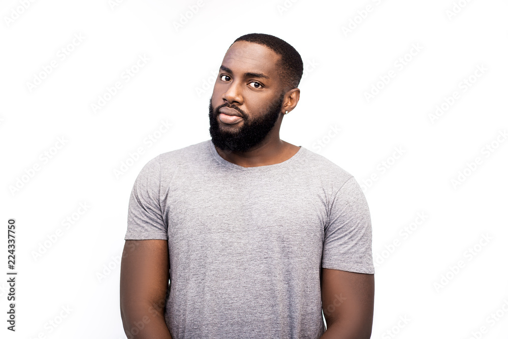 Upset discontent dark skinned male being abused by someone, frowns face ...