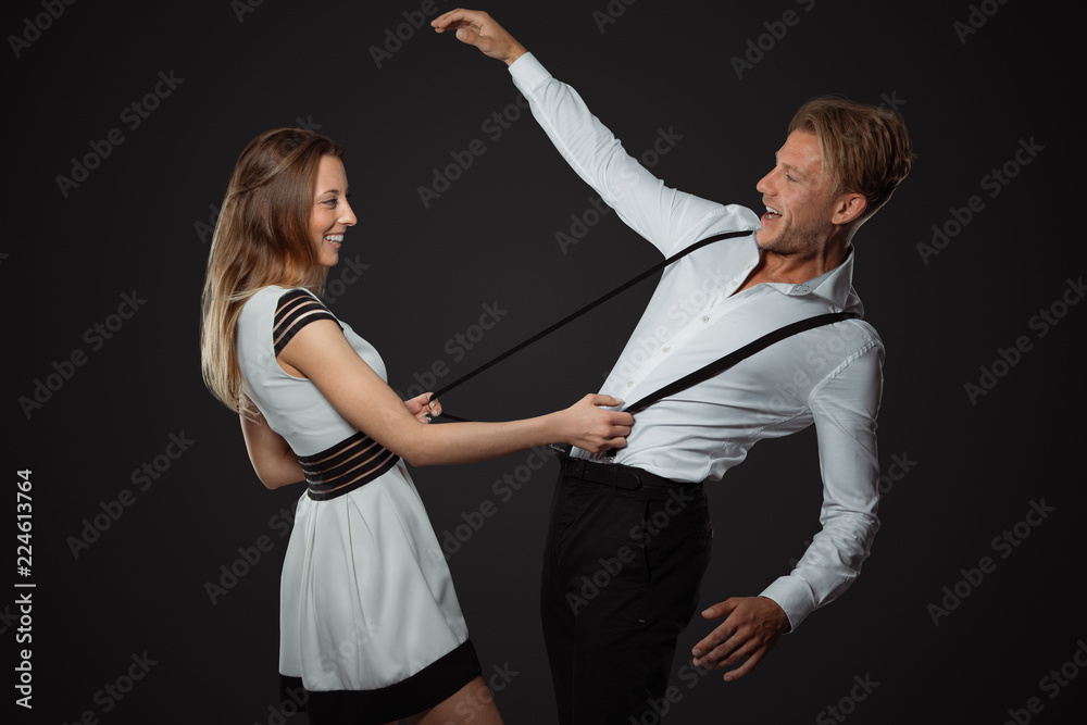 dancing couple in white dress and shirt in studio stand in studio while ...