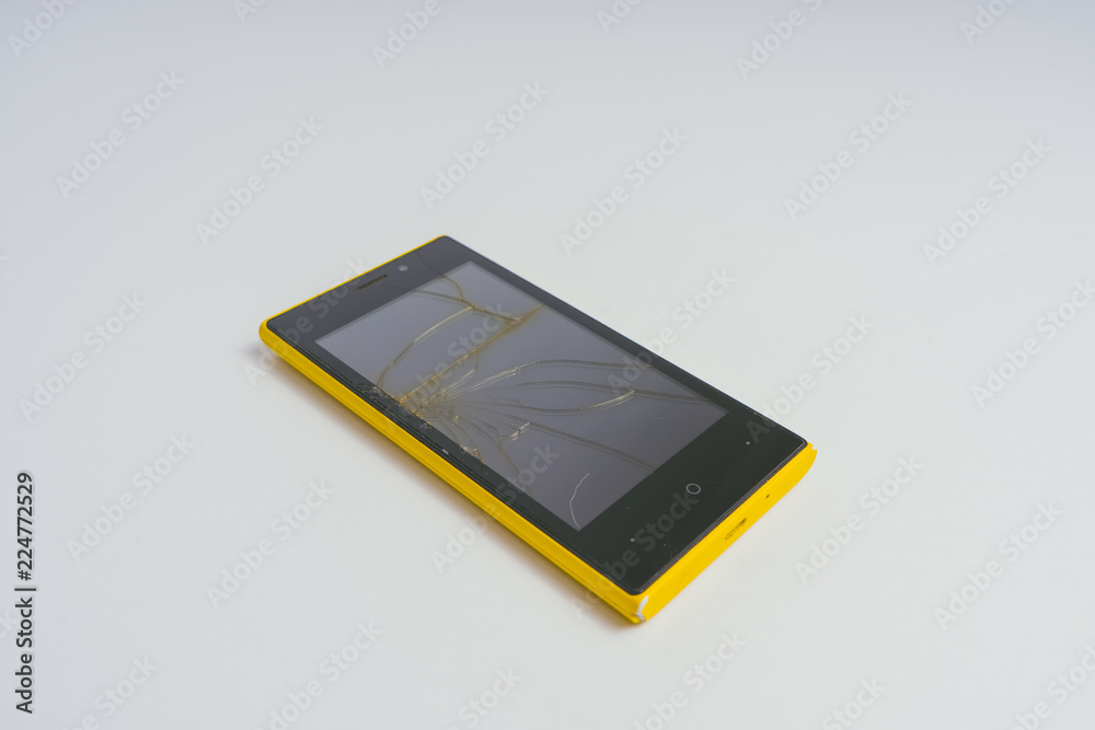 Broken mobile phone screen, scattered shards. Smartphone monitor damage ...
