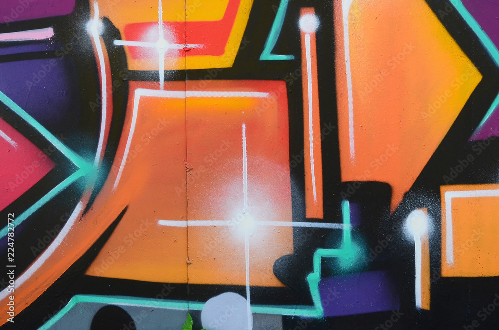 Fragment of graffiti drawings. The old wall decorated with paint stains ...