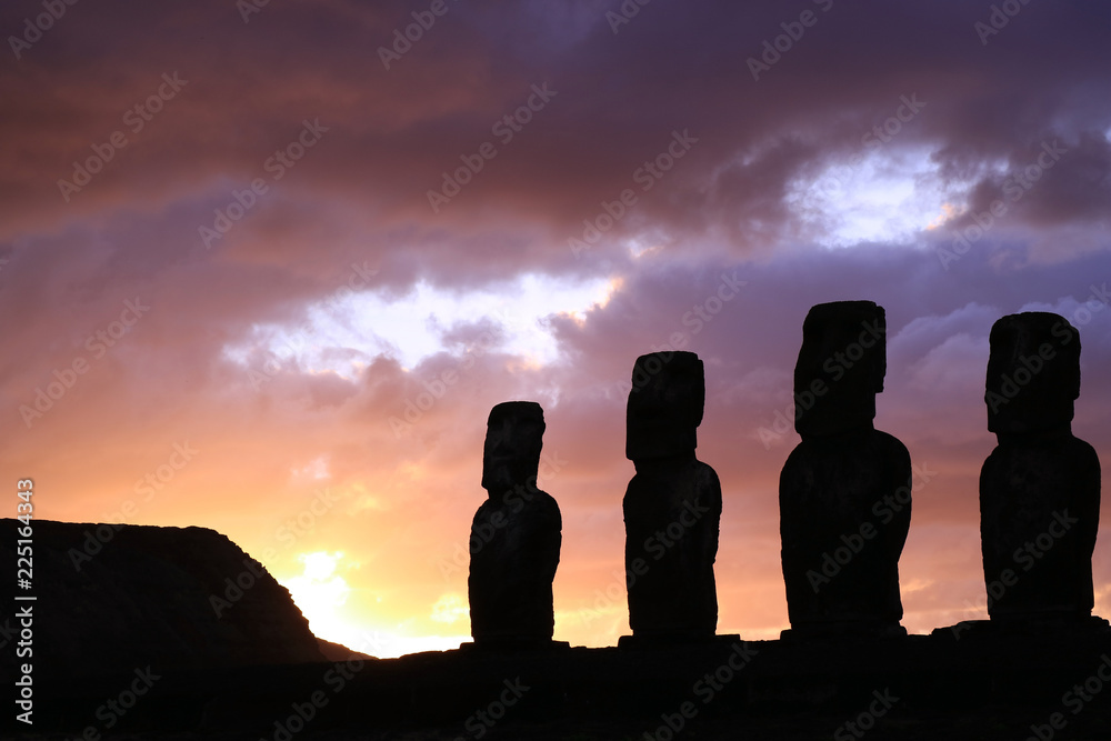 Stunning Purple Sunrise Cloudy Sky over the Silhouette ofthe Giant Moai ...
