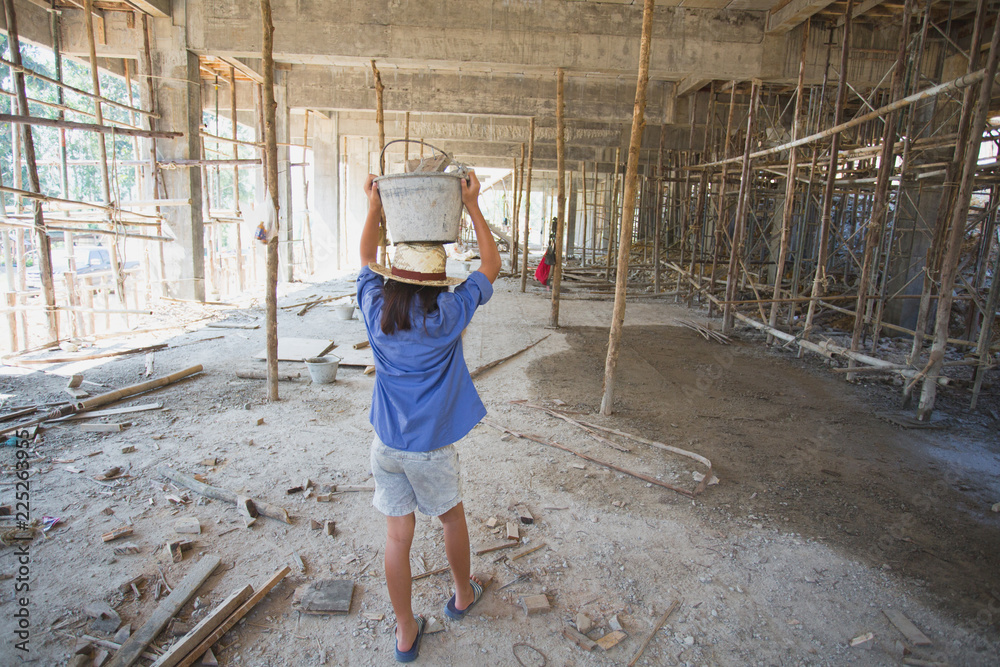 Foto de Stock Poor children working at construction site against ...