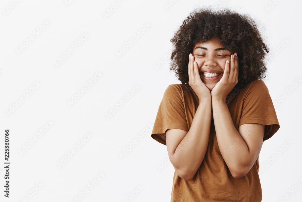 Pleased african america woman in love feeling excitement and affection ...