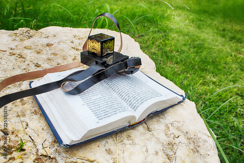 Tefillin (black leather box for Jewish prayers) and Tanakh (Hebrew ...