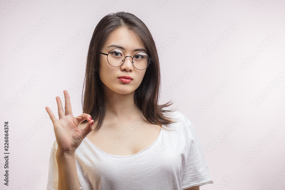 happiness, health and vision concept - joyful young asian woman ...