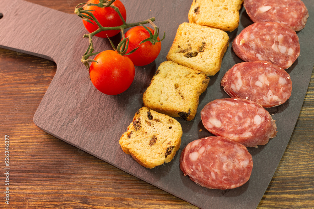 Tabla de embutido español con pan y tomate Stock Photo | Adobe Stock
