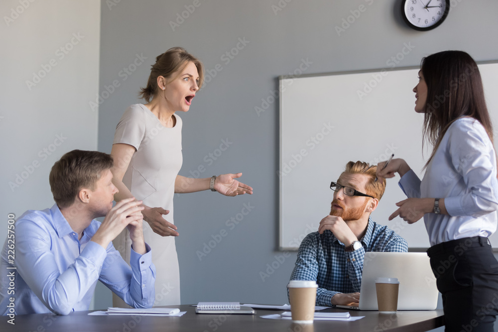 Business women colleagues disputing arguing at corporate office meeting ...