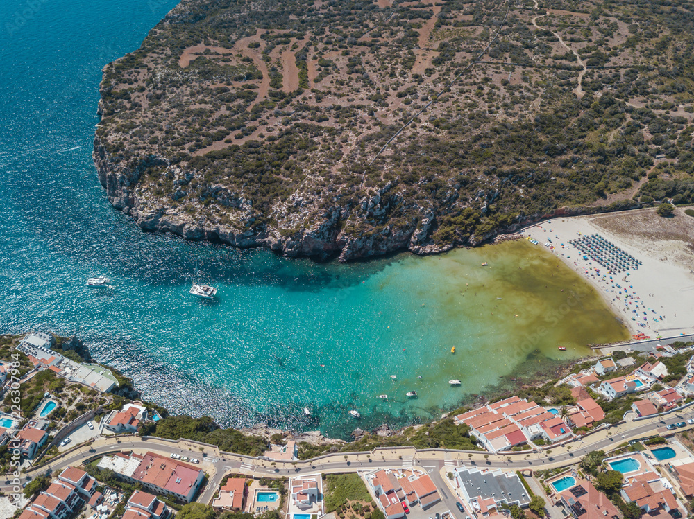 Aerial bird's eye view drone of boat docked in mediterranean tropical ...