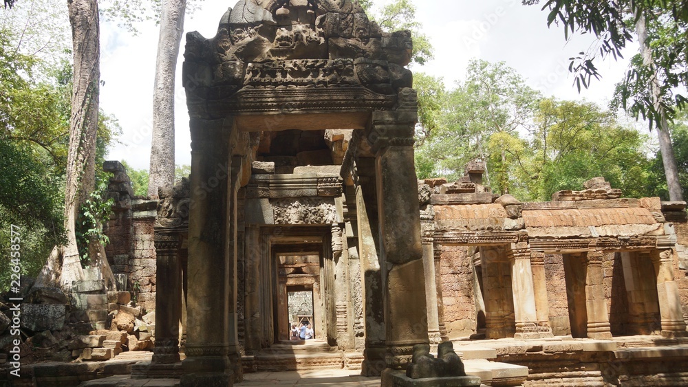 The so-called 'Tomb Raider Temple', Ta Prohm is cloaked in dappled ...