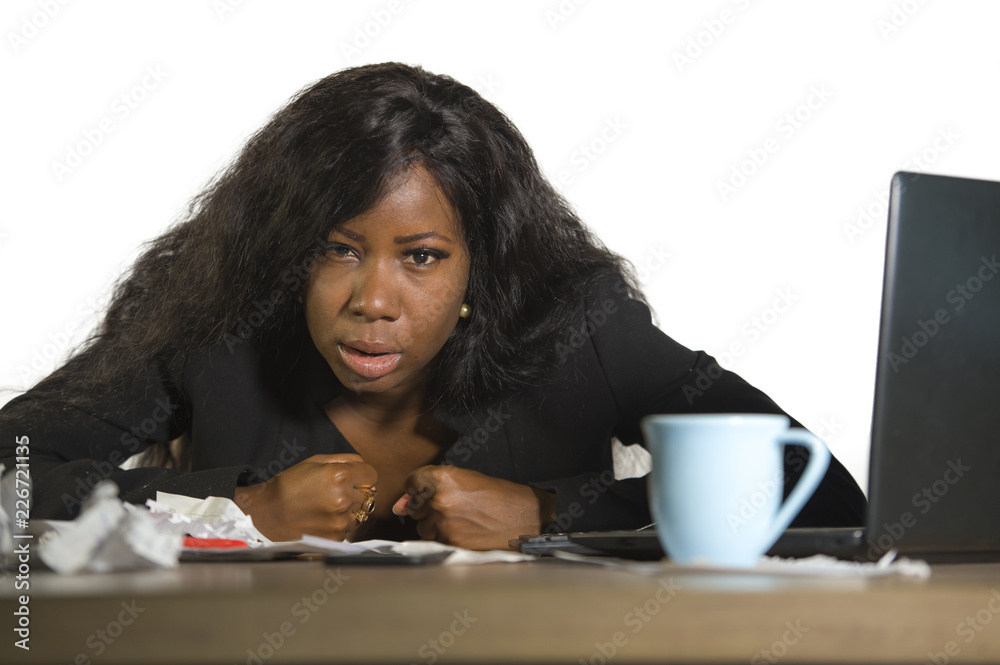 young angry and upset black African American business woman working in ...
