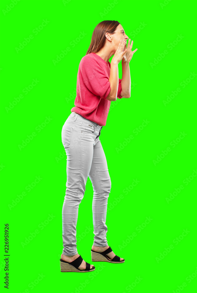 young woman full body. shouting loud like crazy, calling with hand with ...
