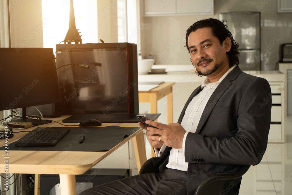 pakistani man working in office Stock Photo | Adobe Stock