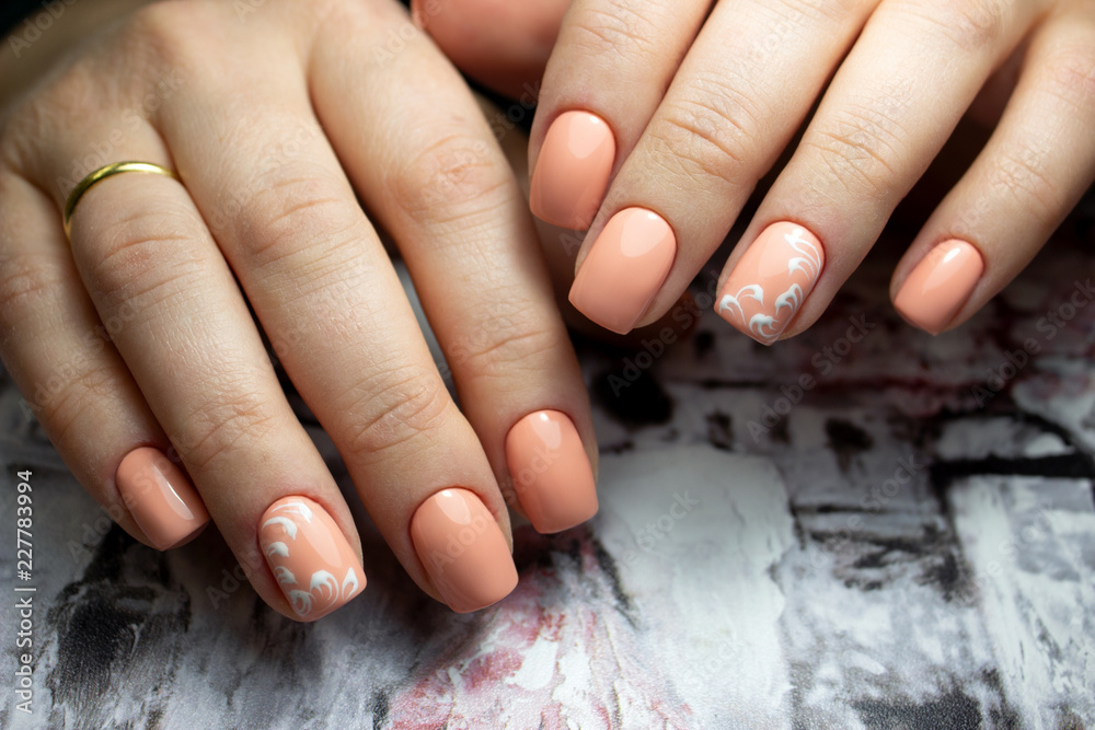 Stock Foto Nails Design. Hands With Bright Orange Manicure On Violet Background. Close Up Of Female Hands With Trendy Orange Art Nail. High Quality Image. Adobe Stock