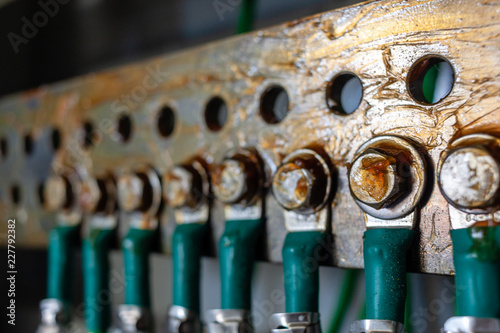 Green electrical ground wires is connected to ground copper terminal ...