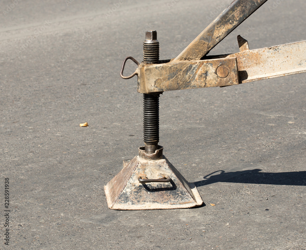 Truck strong outrigger stabilizing legs extended. Working leg from a ...