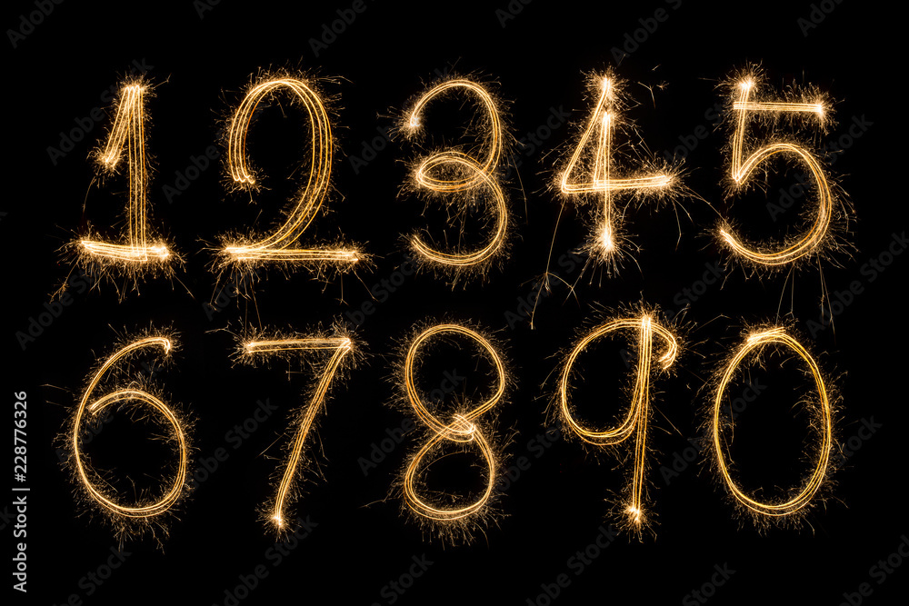 Alphabet and Numbers sparklers on black background Stock Photo | Adobe ...