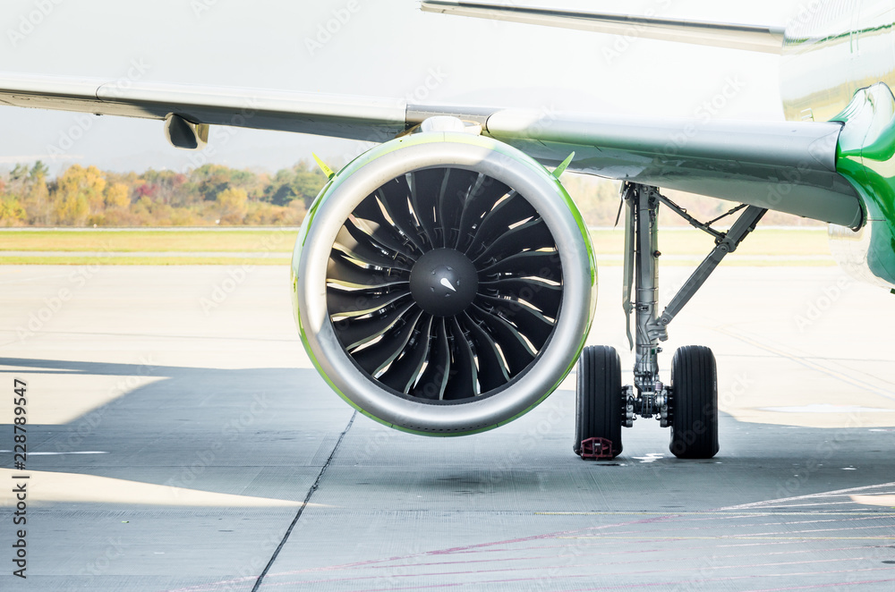 Turbine of aircraft's engine under wing. Plane on runway. Service and ...