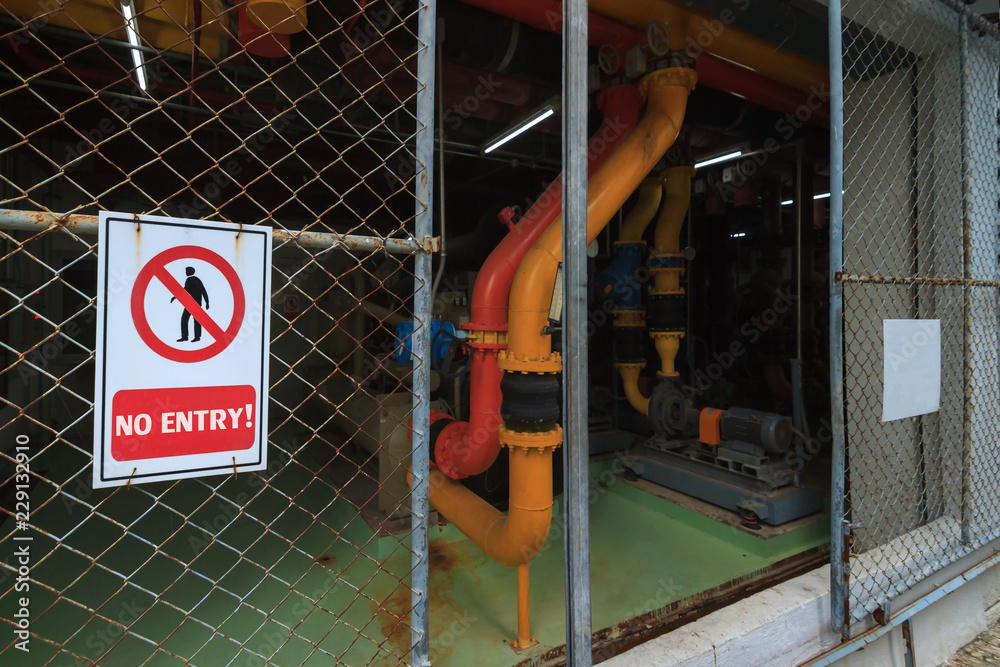 image of No entry sign was stick at the gate of restricted area. Mesh ...