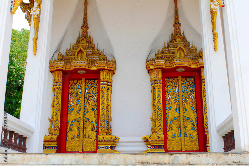 Doors and windows of the temple adorned by intricate wooden carvings in ...