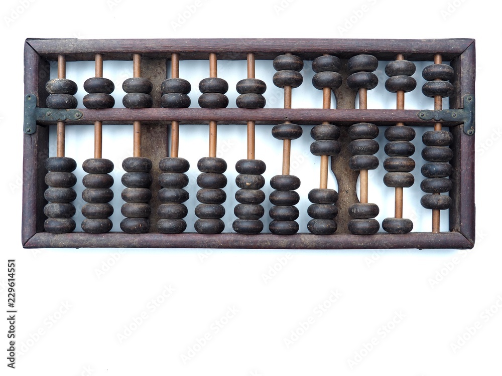 Old and ancient abacus made of wood and attached with a metal plate. On ...