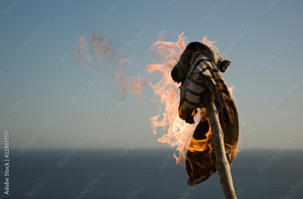 Foto de Stock Burning clothing by the sea in Finisterre, at the end of ...