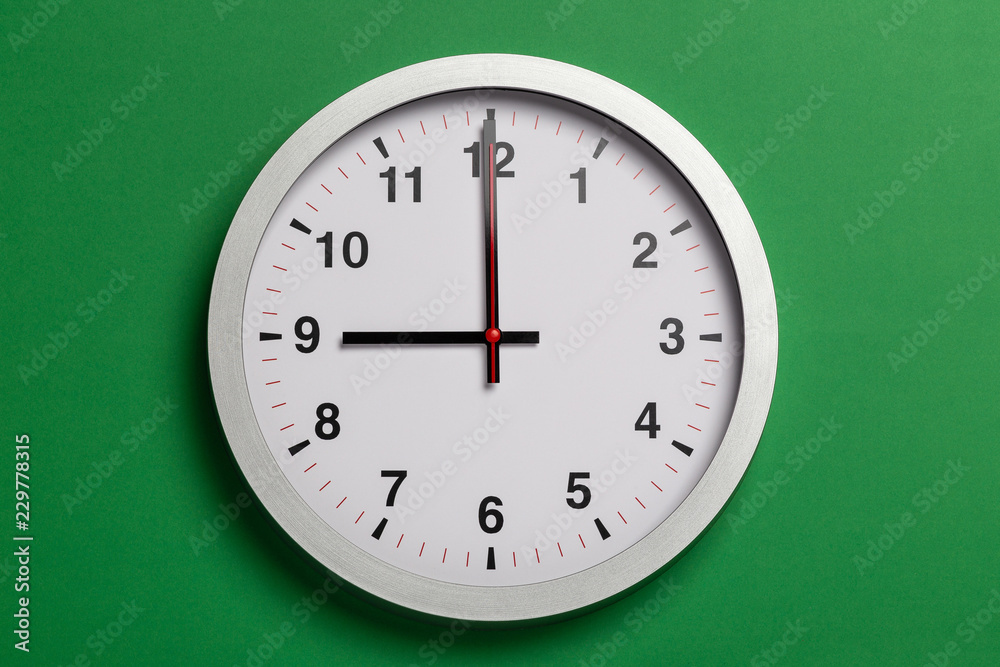 clock shows nine o'clock Stock Photo | Adobe Stock