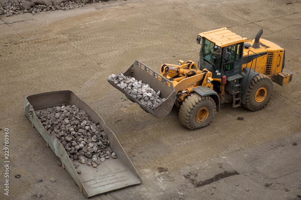 Loading cast iron ingots on ship bulk. Loading metal on ship ...