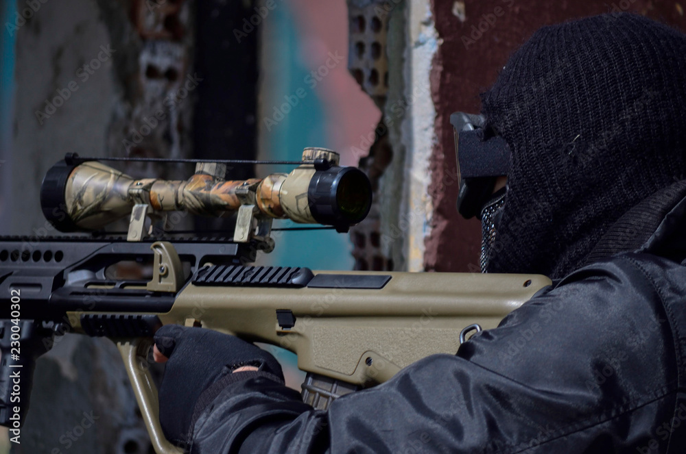 airsoft sniper with scope and black full face mask Stock Photo | Adobe ...