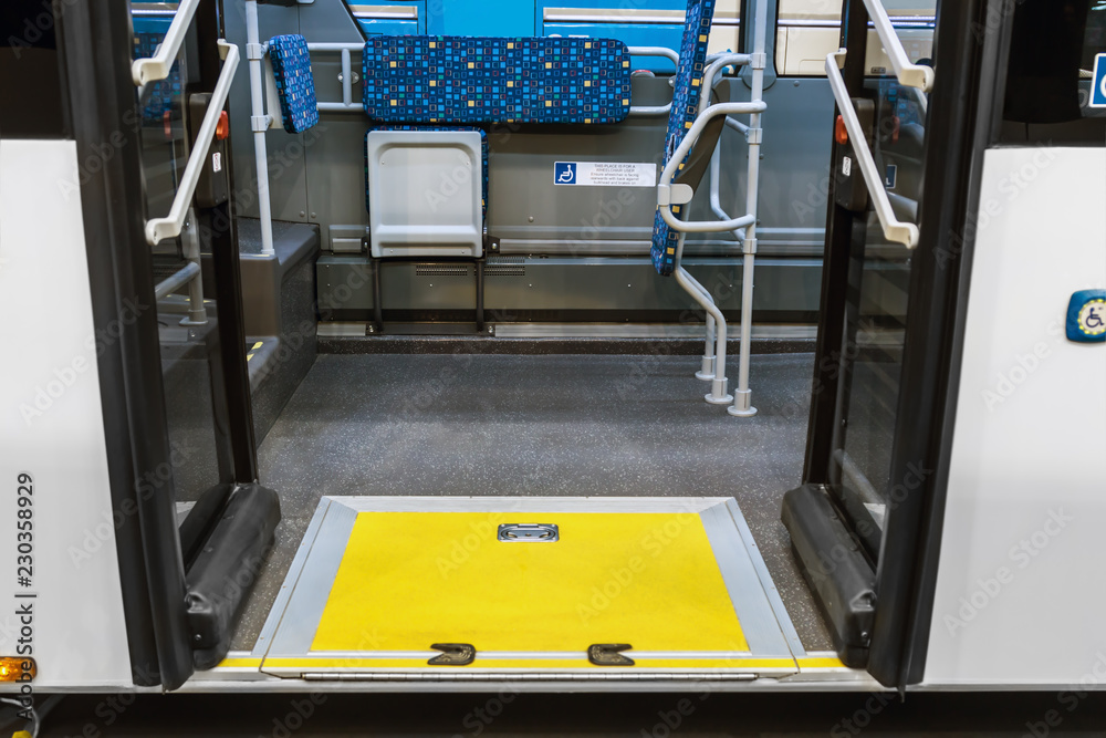 modern city bus with seats for disabled and elderly people. Place for a ...