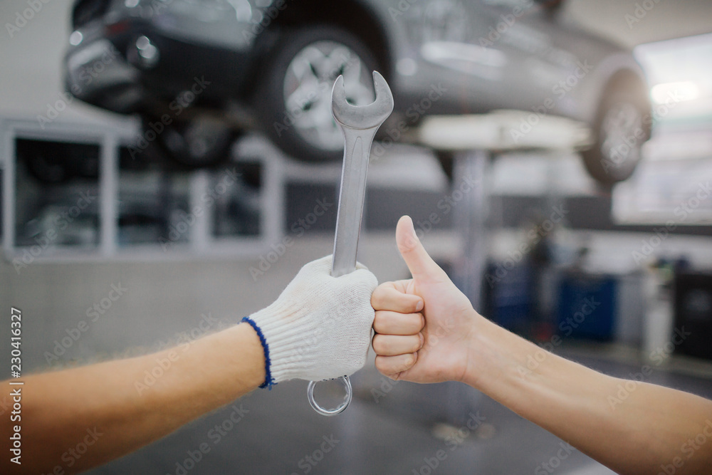 Picture of tow hands touching each other. One of them in gloves and ...