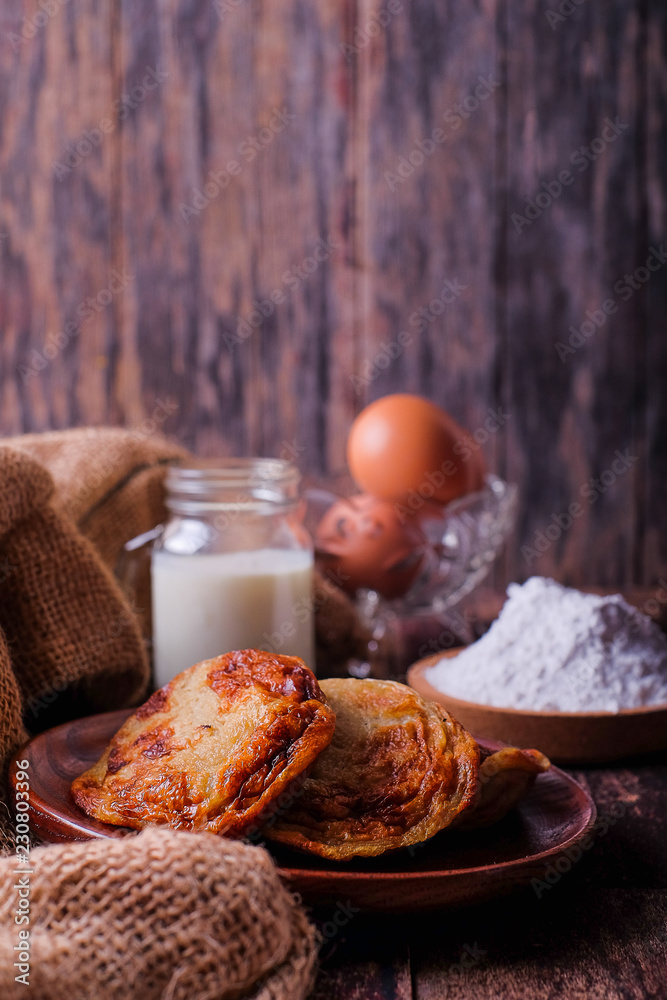 Akok Kedut, egg, coconut, flour , coconut milk and Pandan leaf on ...