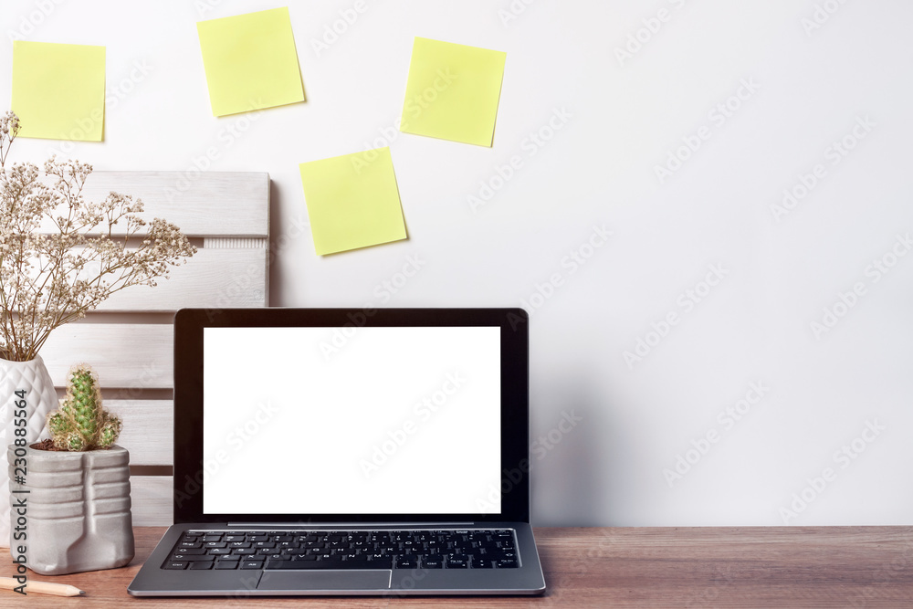 Hipster desk with a laptop mockup, cactus in a gray concrete pot, a ...