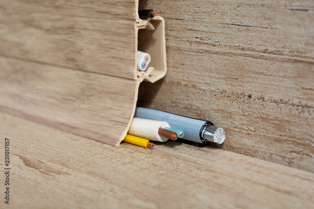 laying of wires in a floor plastic skirting board. laying wires under ...