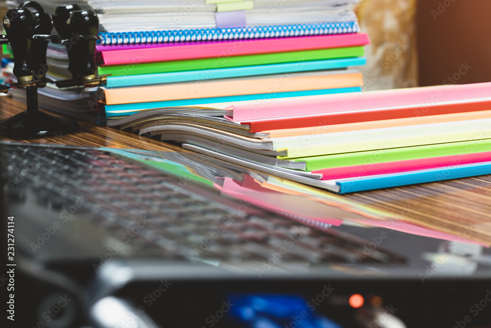 Pile of unfinished documents on office desk. Stack of homework ...