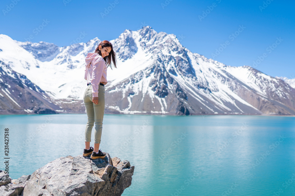 Girl looking at the amazing mountain views of the turquoise waters from ...