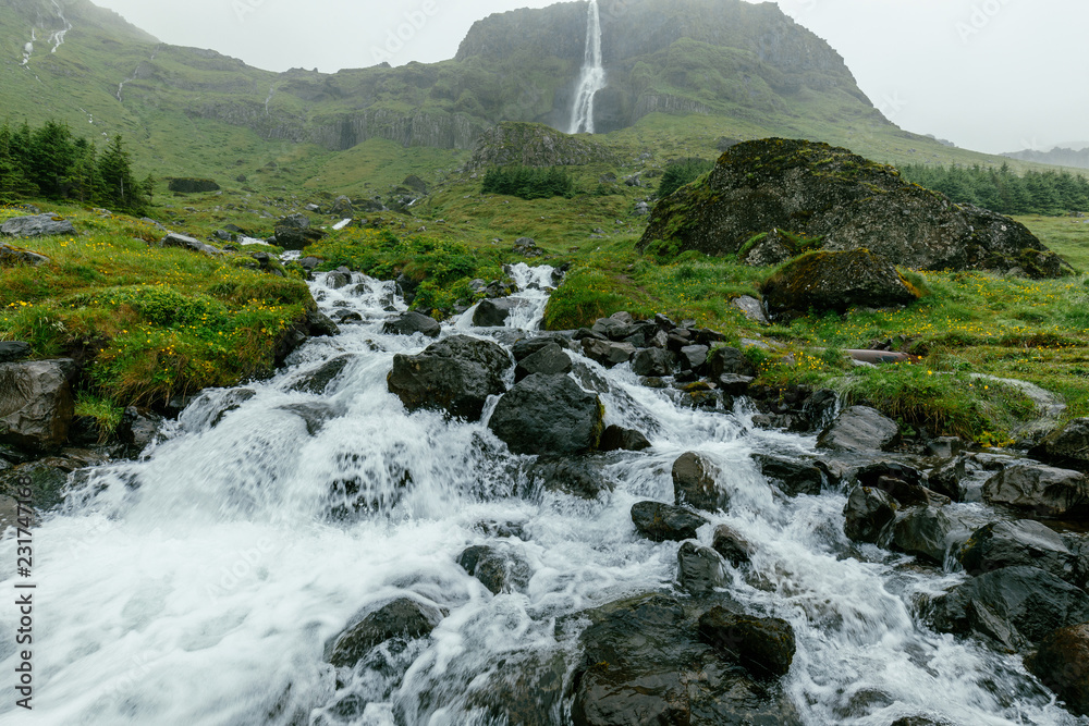 View at the stream of spectacular Bjarnarfoss waterfall in Iceland ...