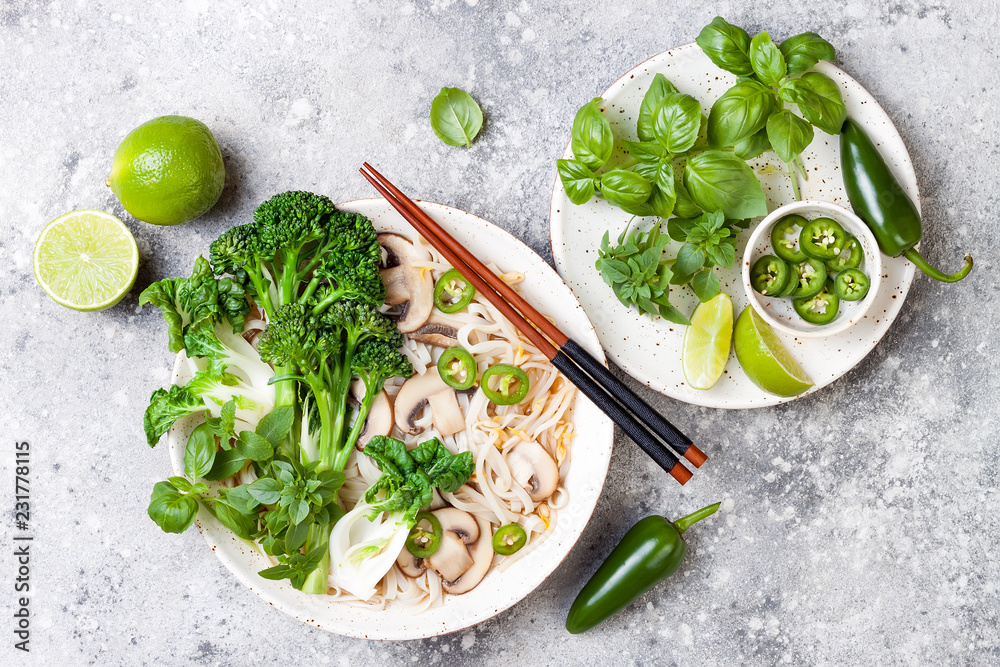 Vegetarian traditional Vietnamese soup Pho bo with herbs, rice noodles ...