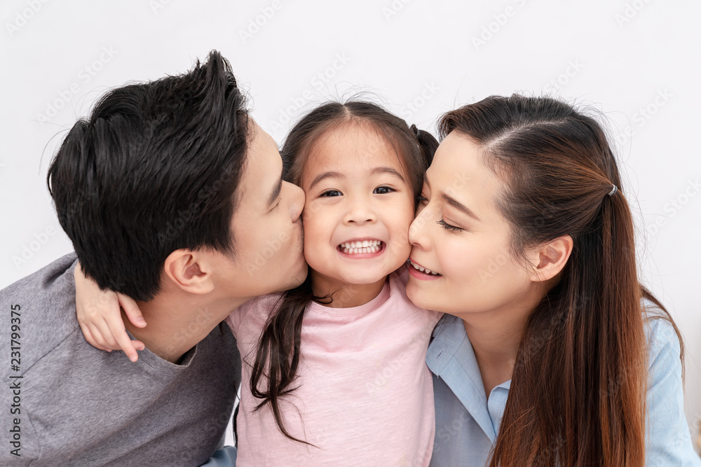 Portrait of attractive asian family kissing cheek together close up on ...
